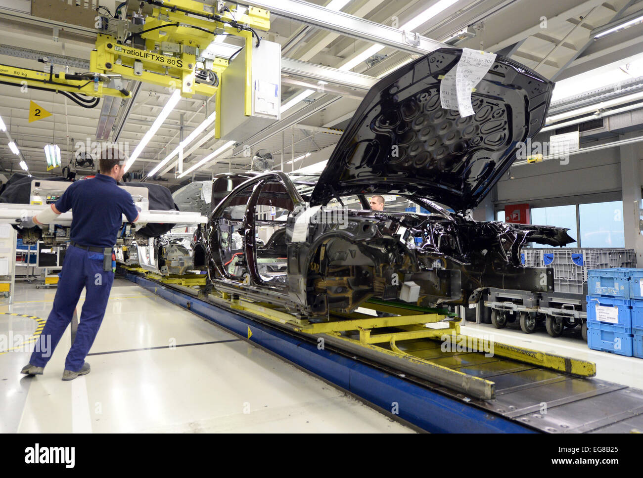 Employees are busy at work on the production line for a Mercedes S ...