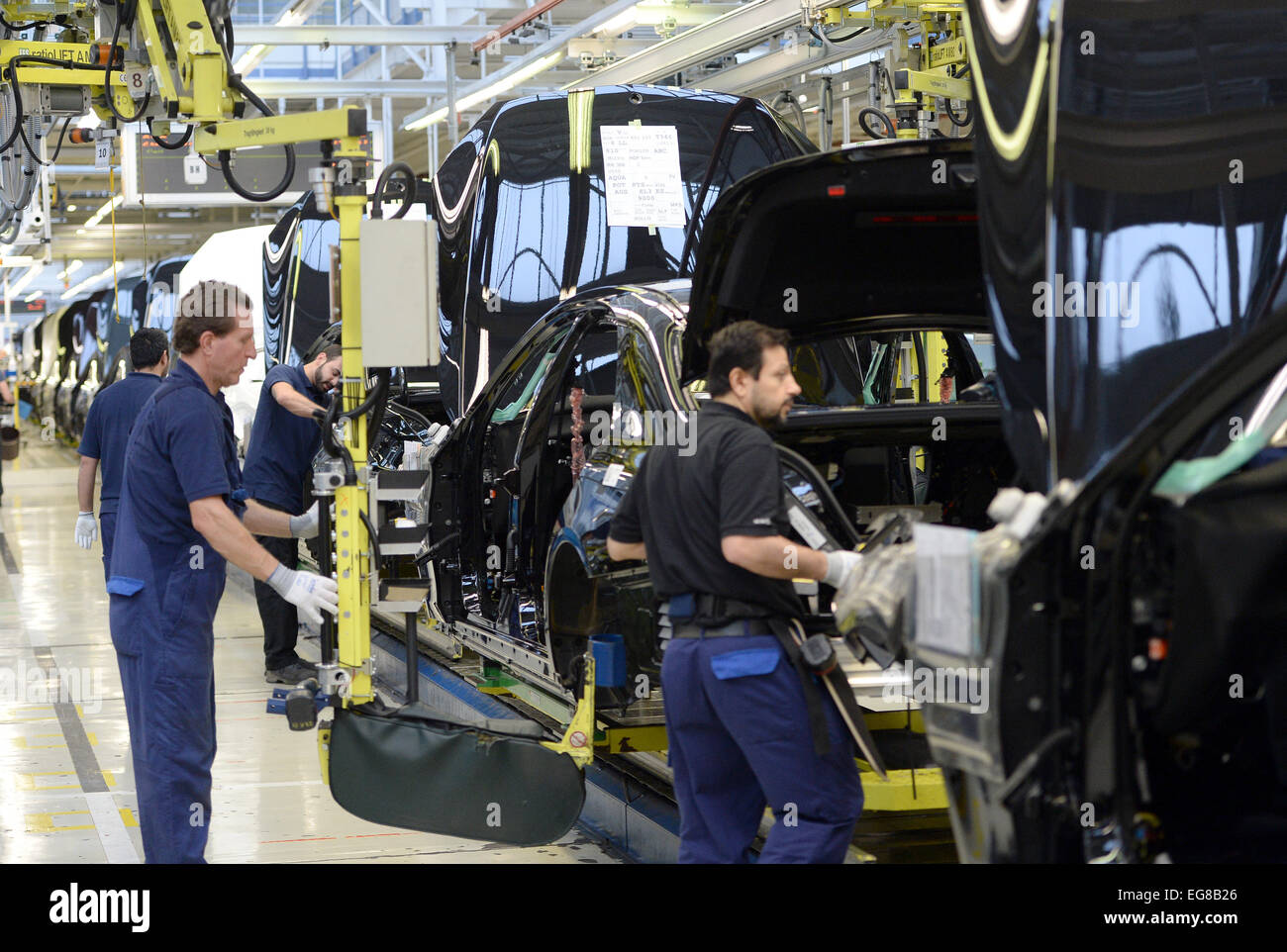 Employees are busy at work on the production line for a Mercedes S ...