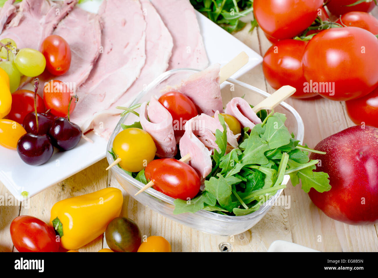 choice of cold cuts with tomatoes, peppers and salad Stock Photo - Alamy