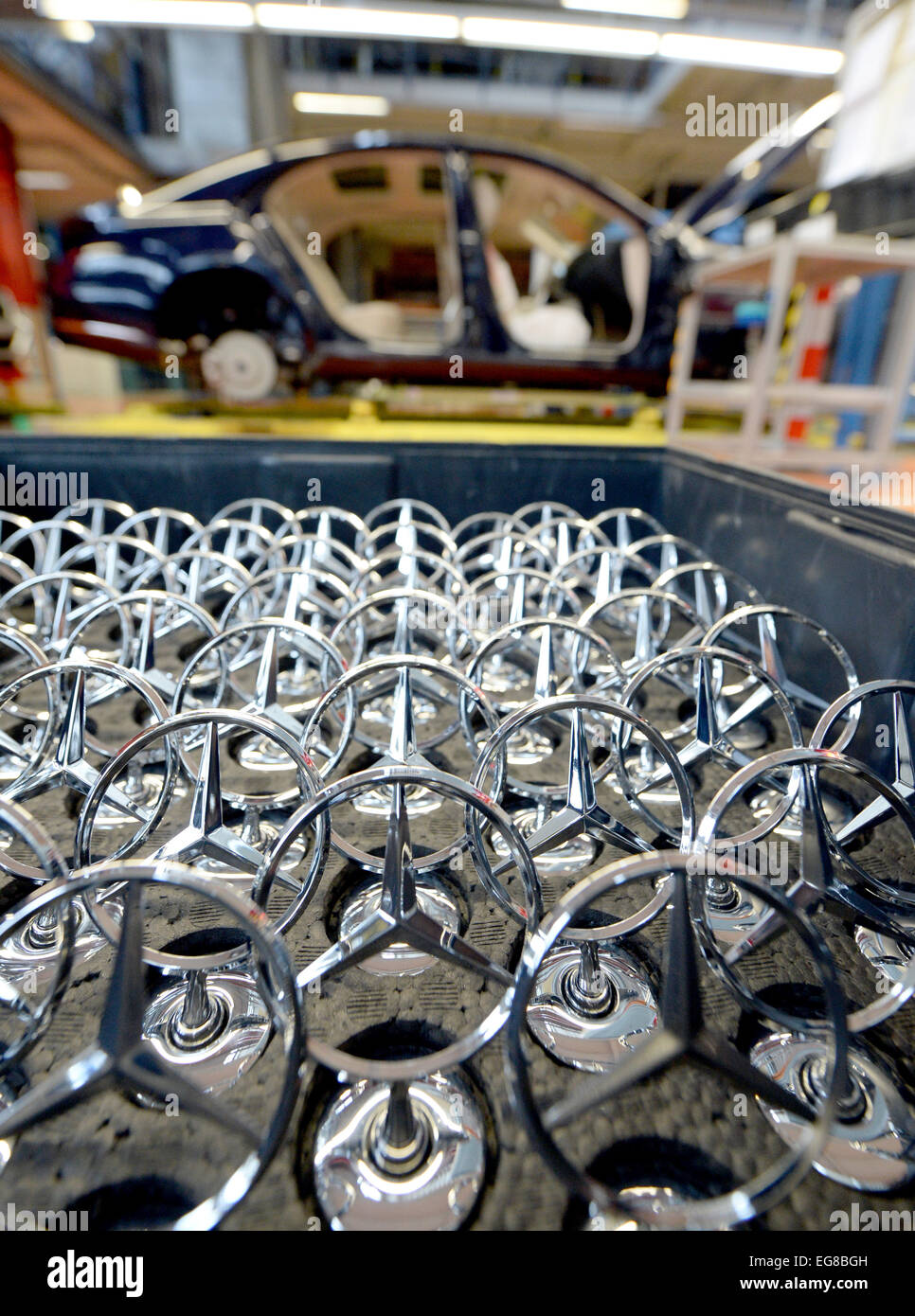 Employees are busy at work on the production line for a Mercedes S ...
