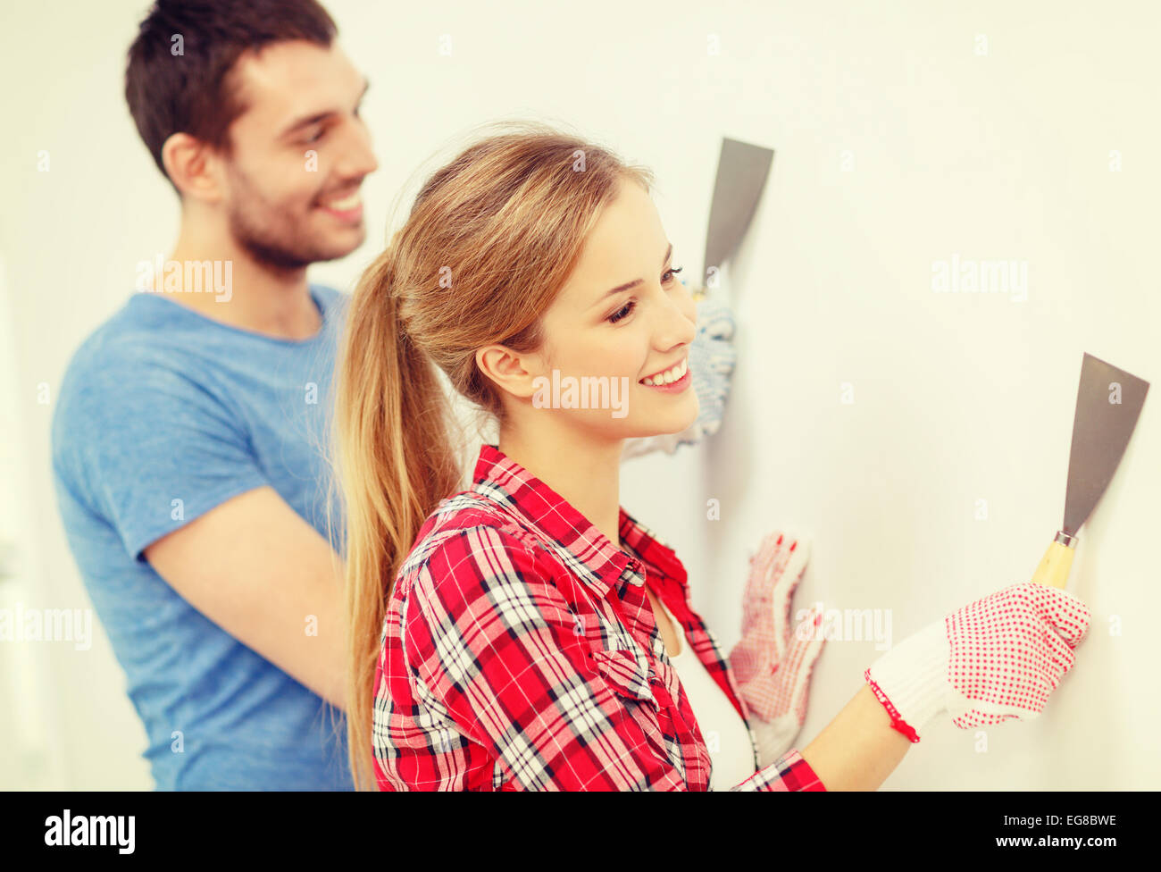 Happy female plasterer hi-res stock photography and images - Alamy
