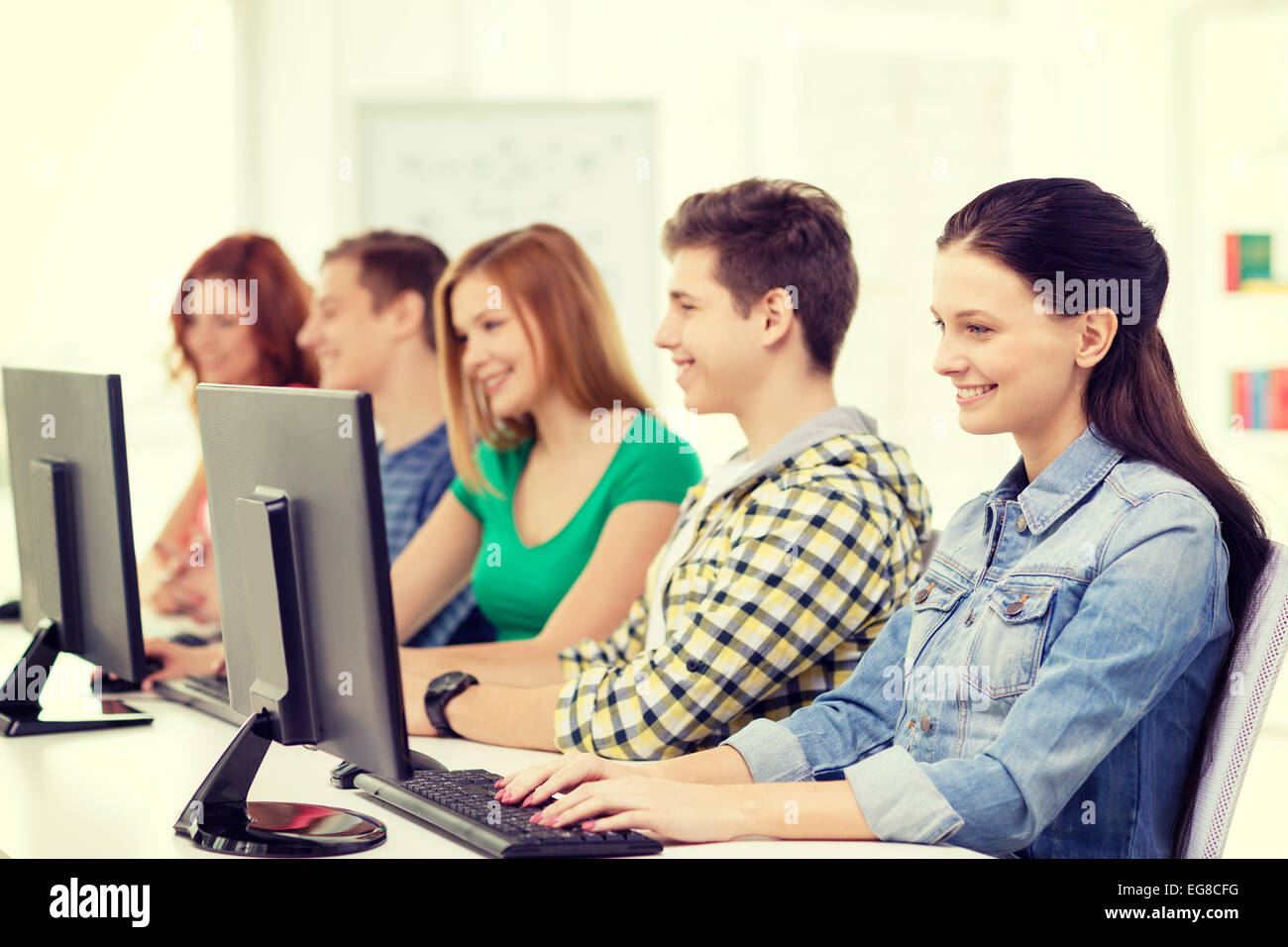 female student with classmates in computer class Stock Photo - Alamy
