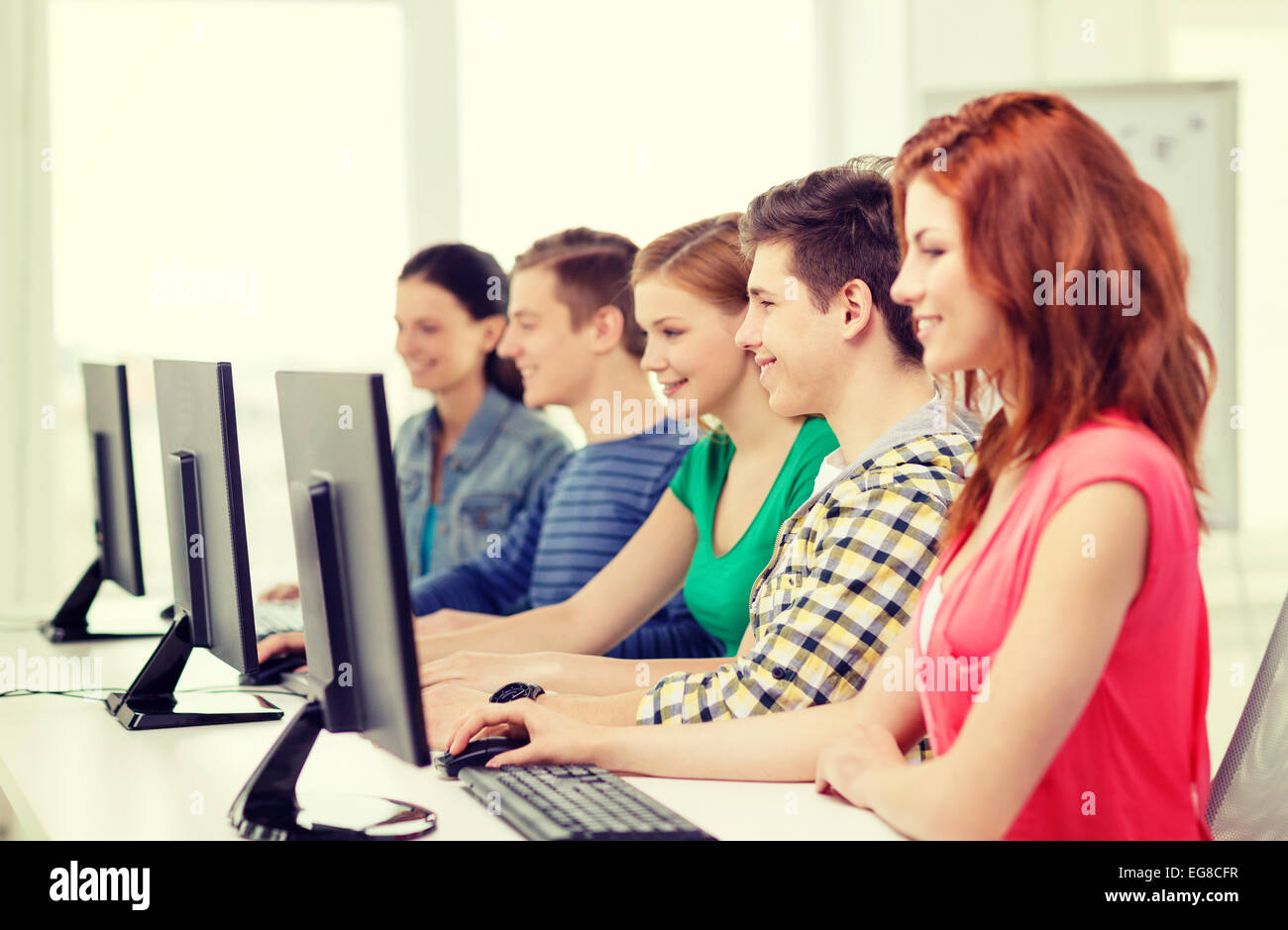 female student with classmates in computer class Stock Photo - Alamy