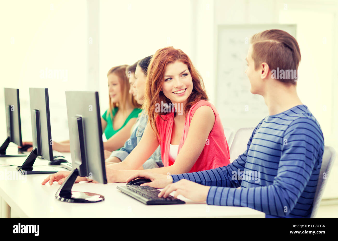 smiling students in computer class at school Stock Photo - Alamy