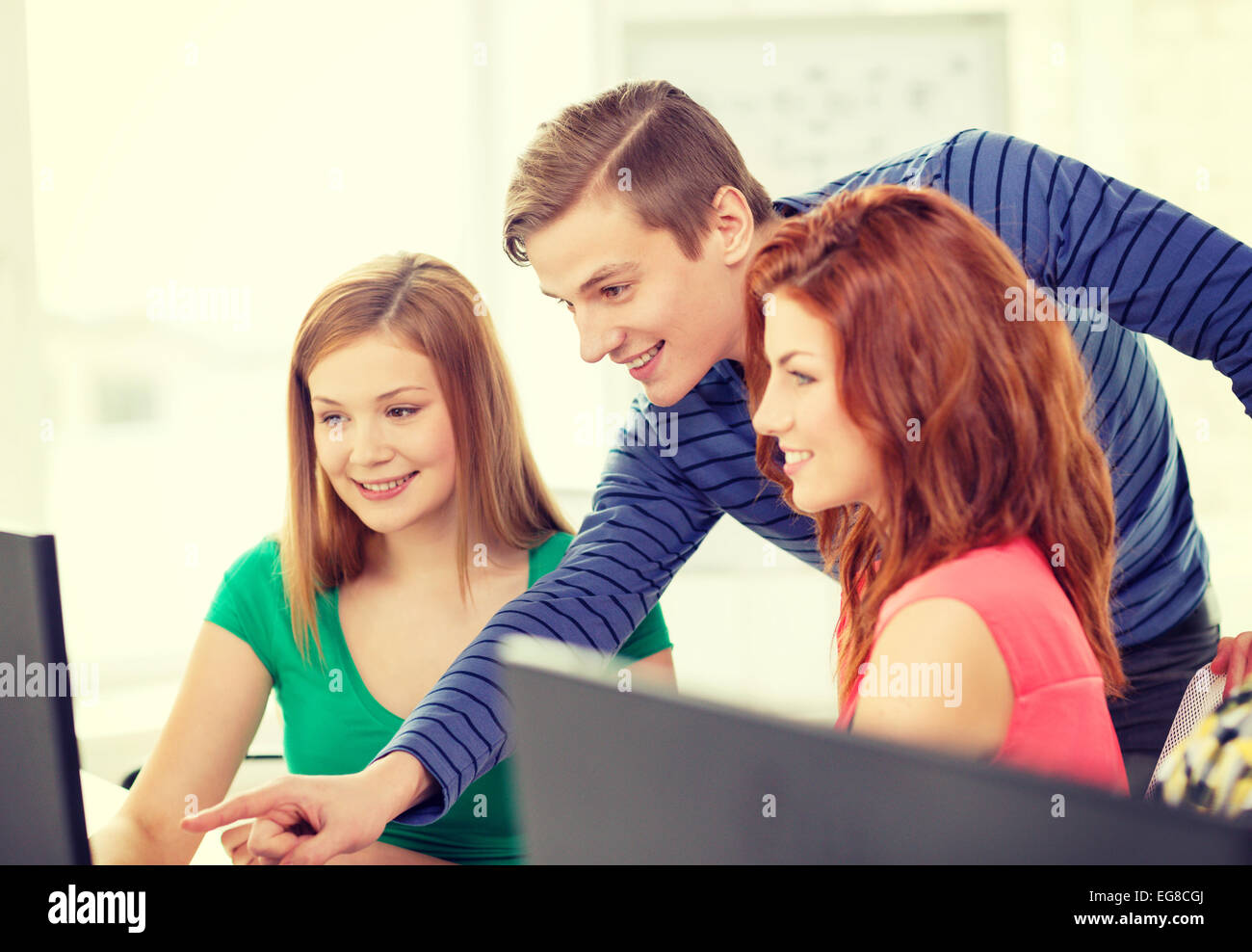 group of smiling students having discussion Stock Photo - Alamy
