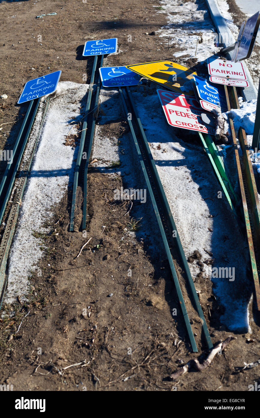 A pile of handicap and other road signs on snowy dirt Stock Photo - Alamy