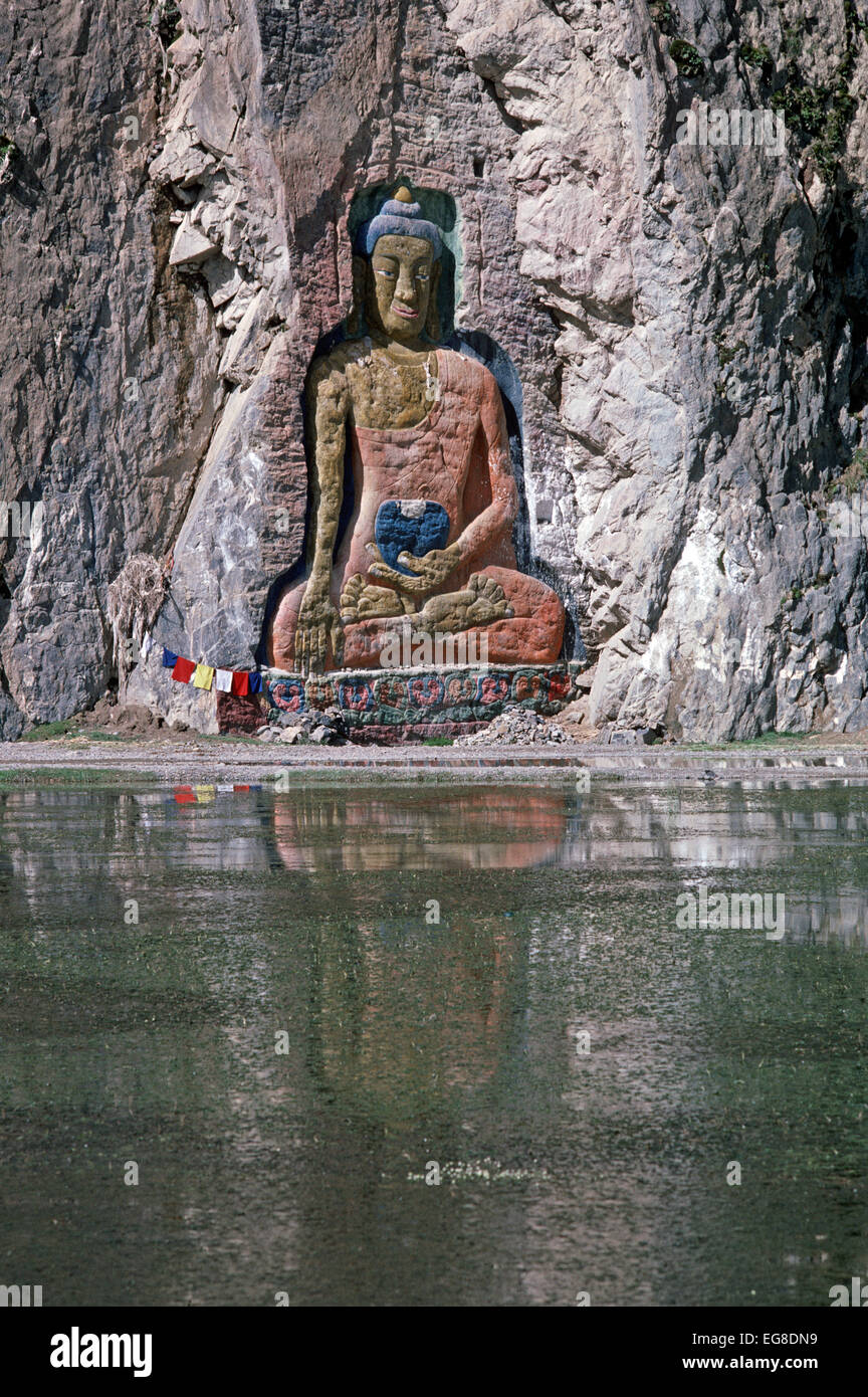 Statue of Buddha carved out of the cliff face, Tibet, Autonomous Region ...