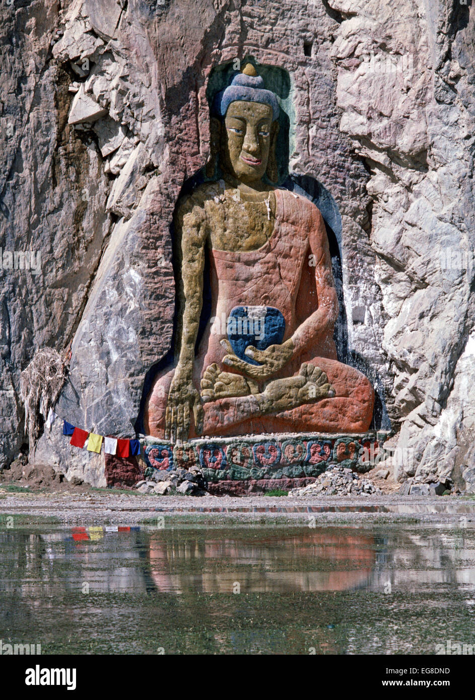 Statue of Buddha carved out of the cliff face, Tibet, Autonomous Region ...