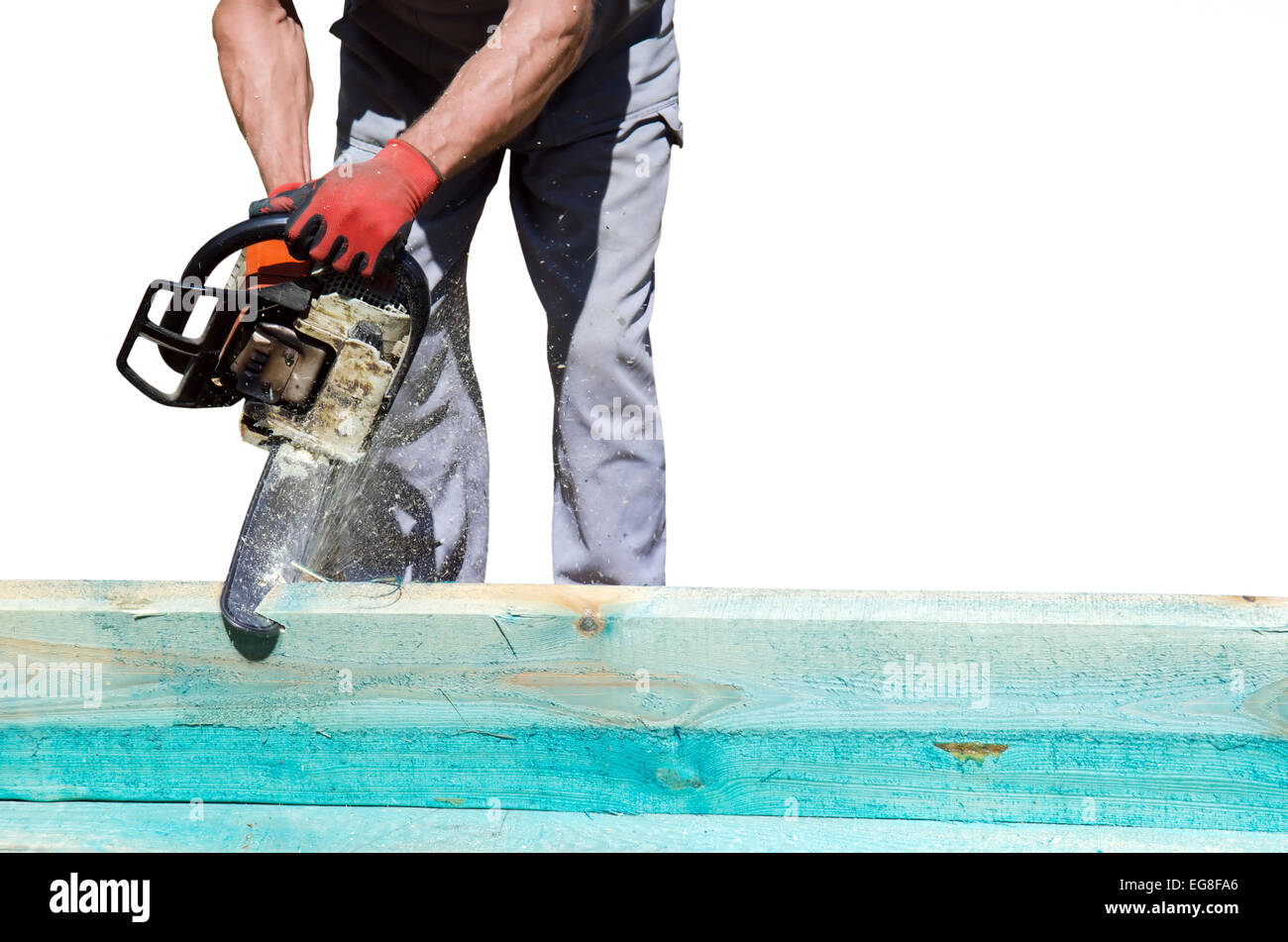 Man sawing a wooden beam with a chain saw Stock Photo - Alamy