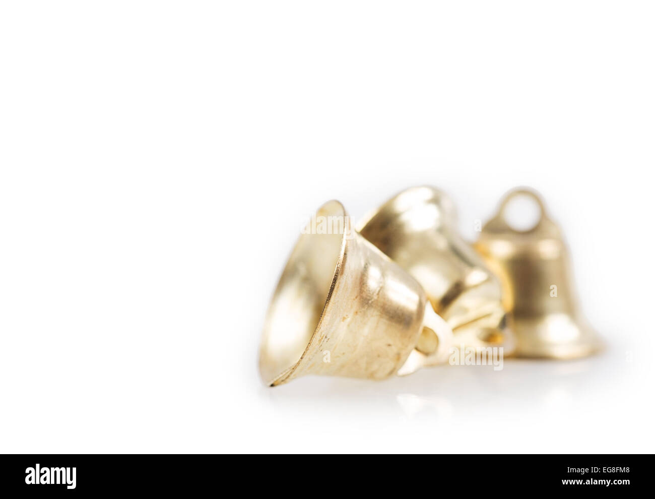 bell isolated white bells gold background Stock Photo - Alamy