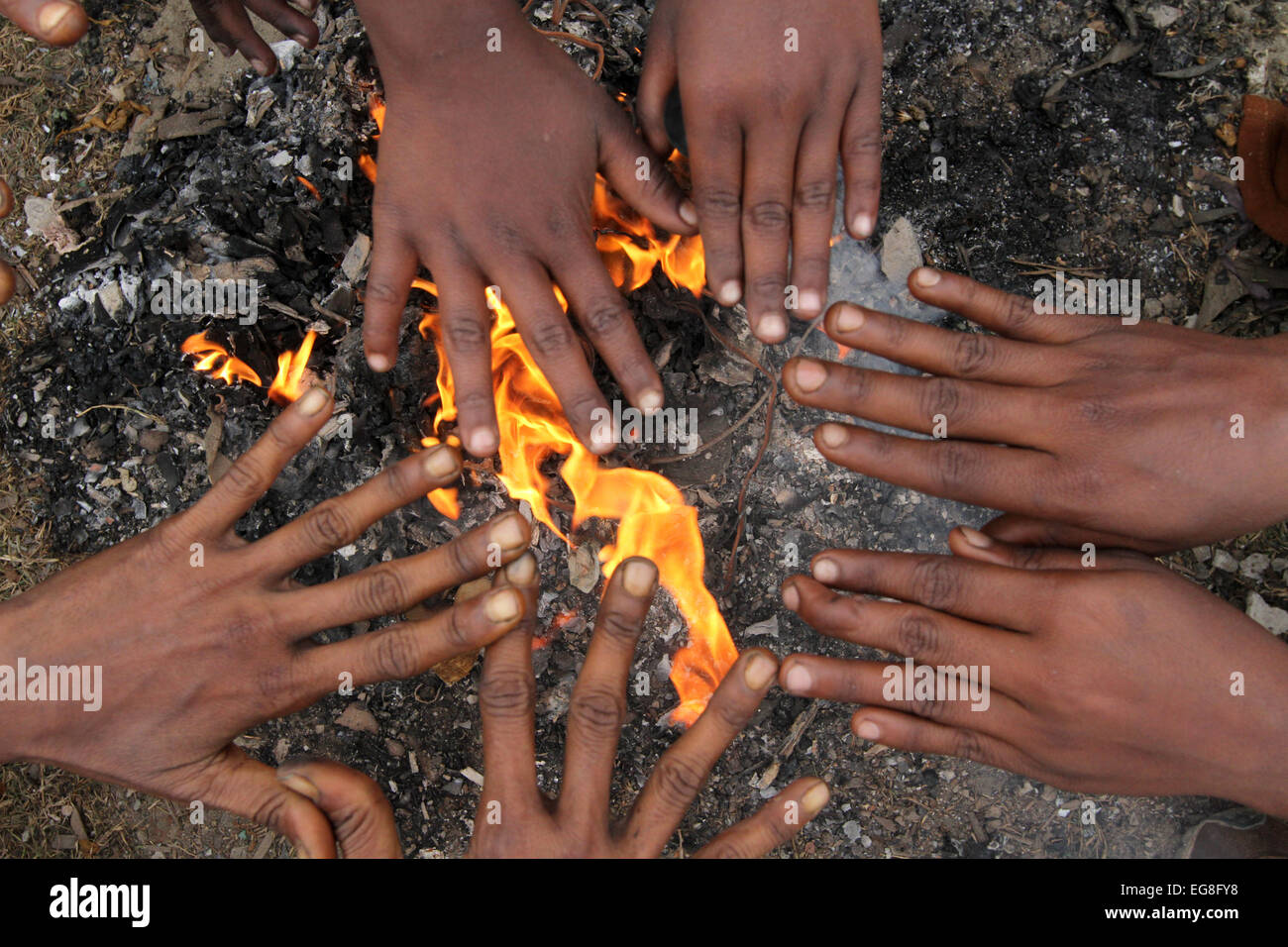 Homeless children create fire by using discarded wood or plastic to ...