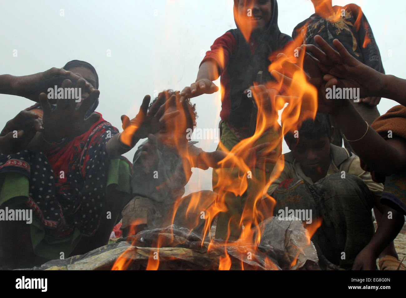 Homeless children create fire by using discarded wood or plastic to ...
