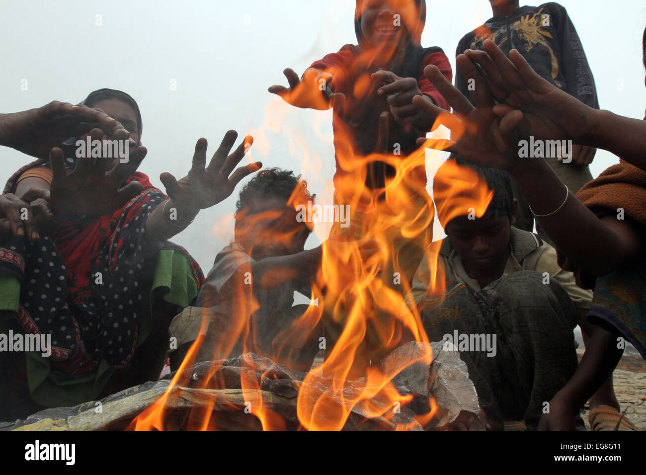 Homeless children create fire by using discarded wood or plastic to ...
