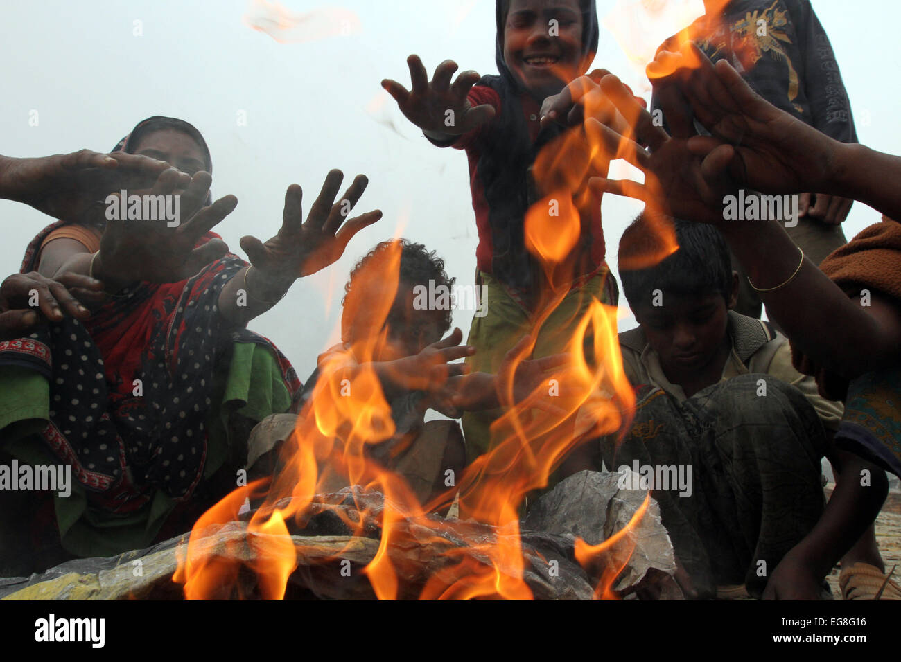 Homeless children create fire by using discarded wood or plastic to ...