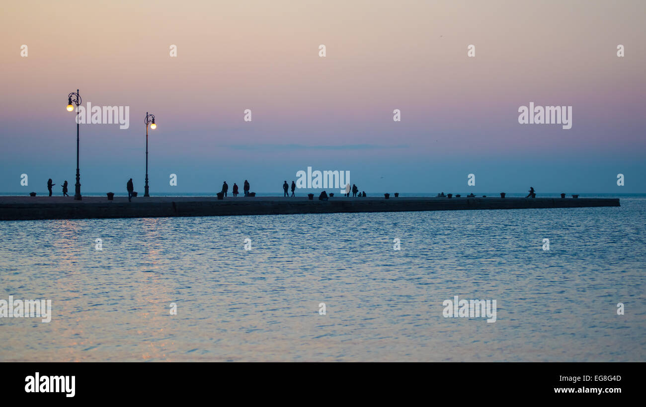 Trieste, Italy - People strolling on the Molo Audace pier in Trieste at ...
