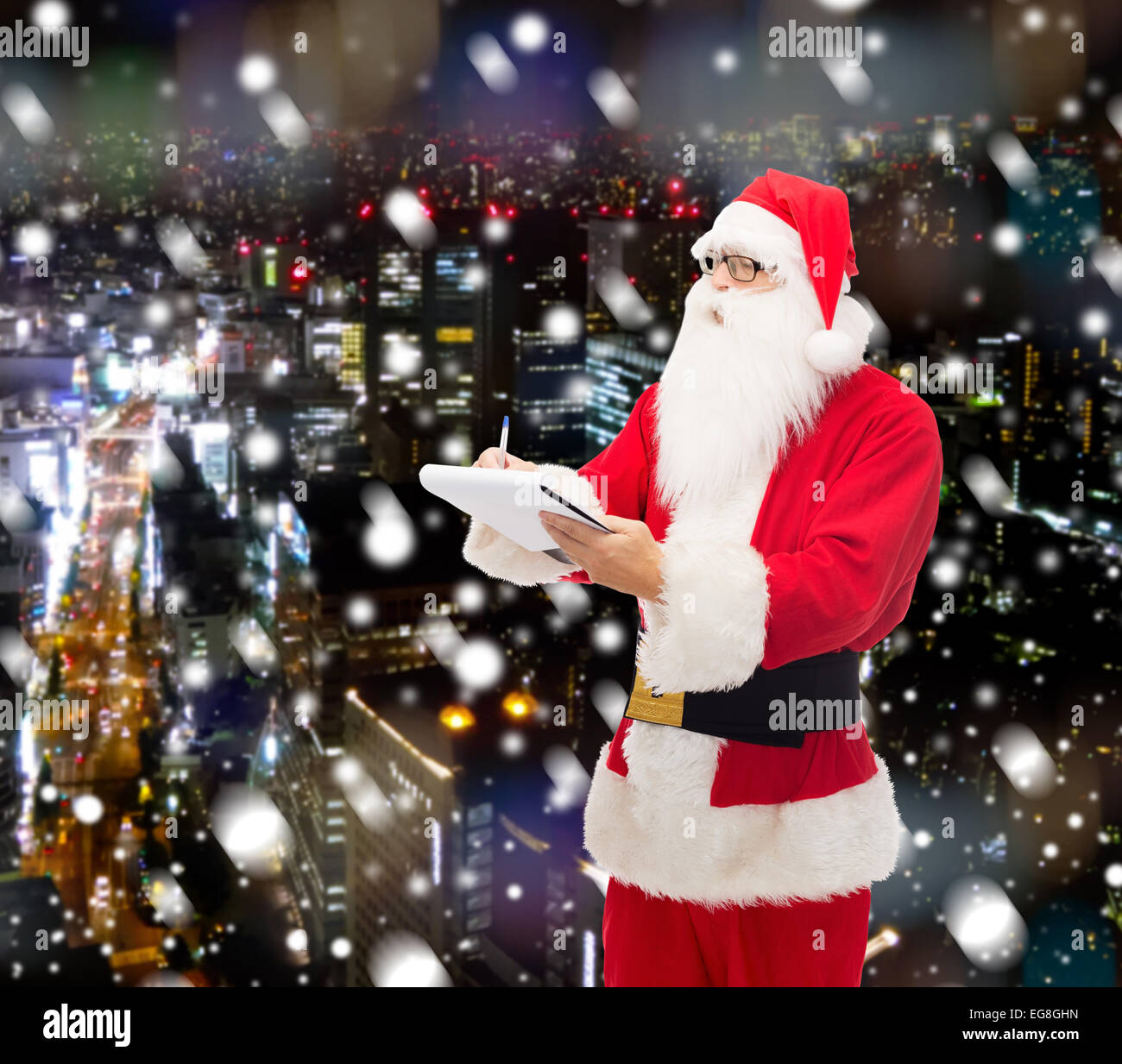 man in costume of santa claus with notepad Stock Photo - Alamy