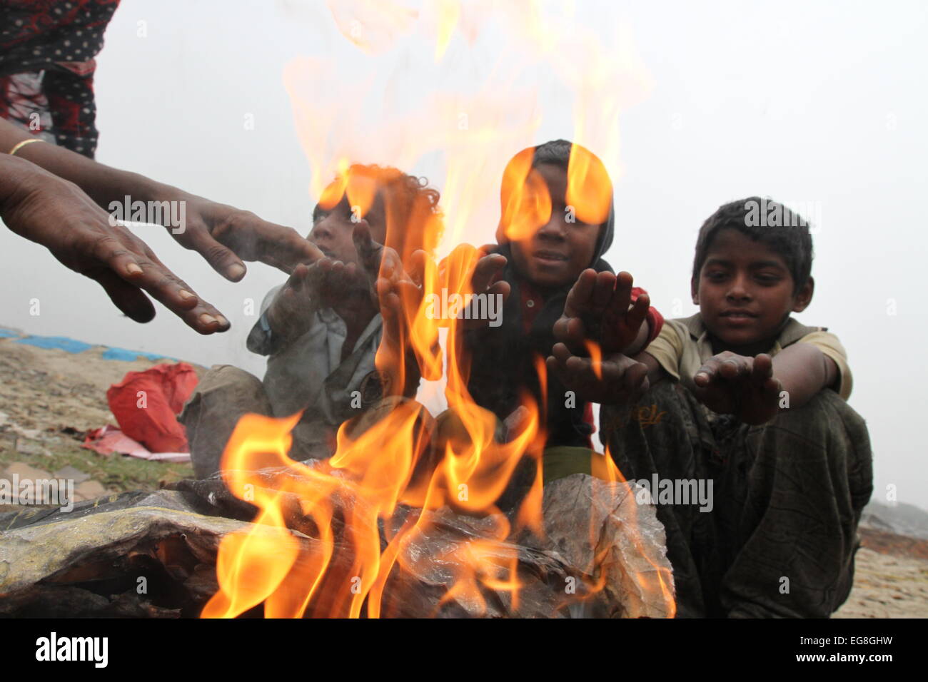Homeless children create fire by using discarded wood or plastic to ...