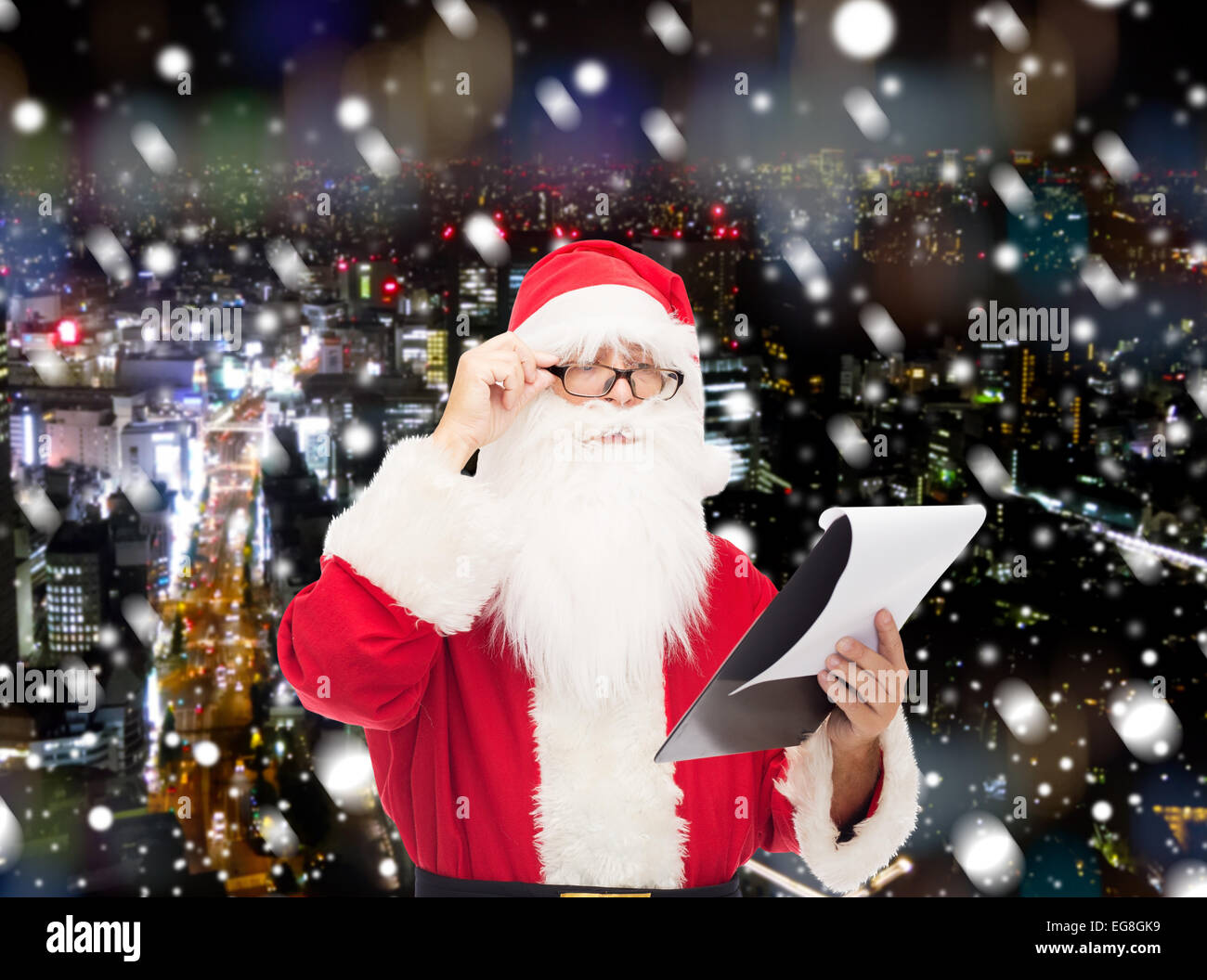 man in costume of santa claus with notepad Stock Photo - Alamy