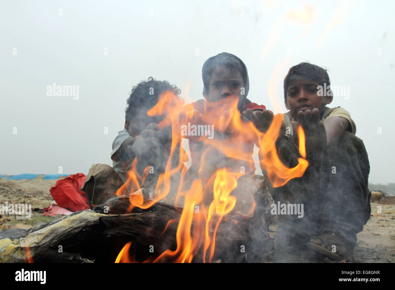 Homeless children create fire by using discarded wood or plastic to ...