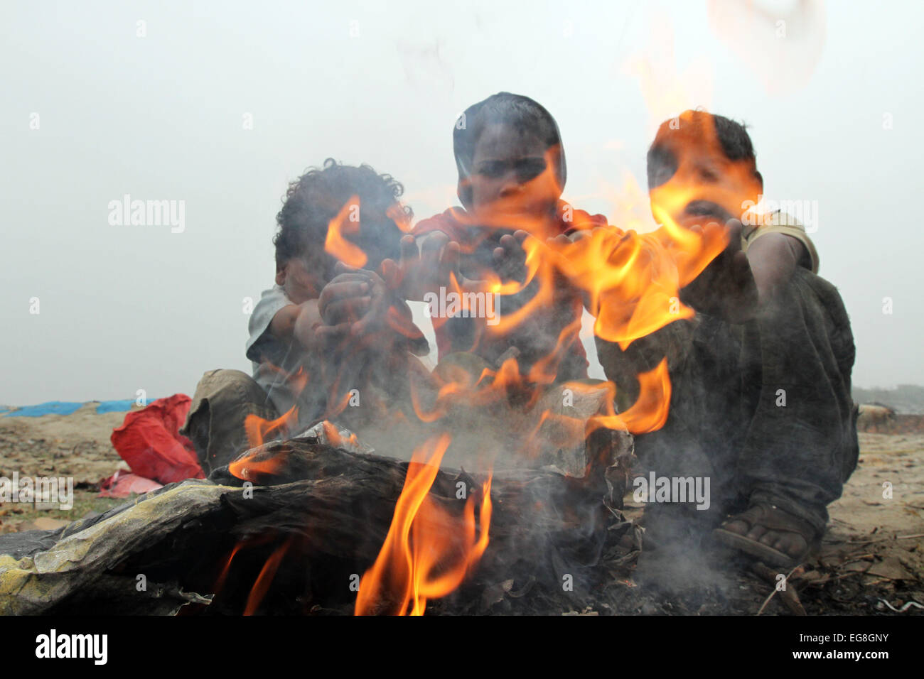 Homeless children create fire by using discarded wood or plastic to ...