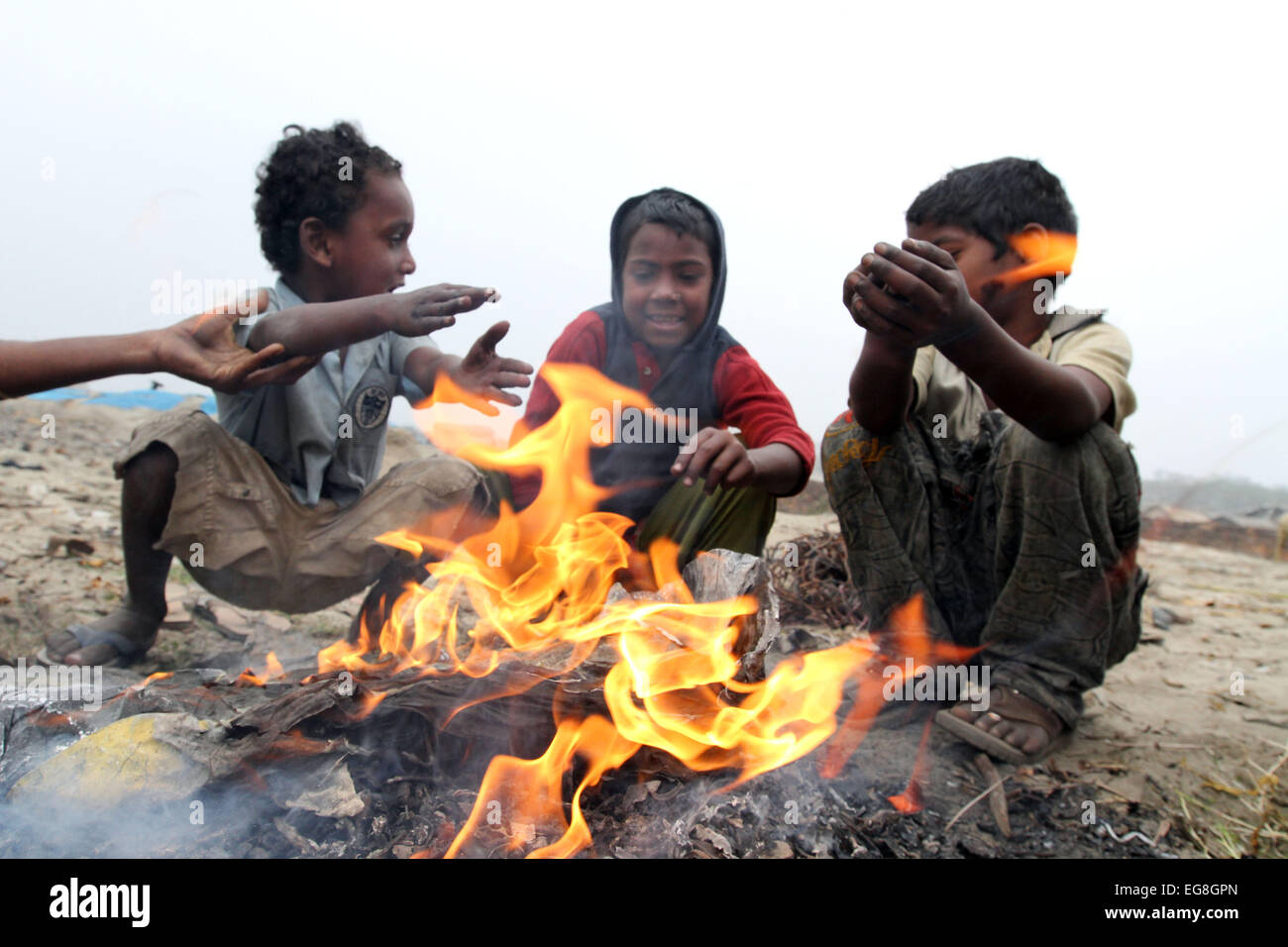 Homeless children create fire by using discarded wood or plastic to ...