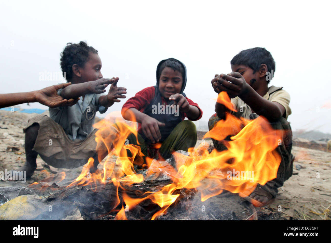 Homeless children create fire by using discarded wood or plastic to ...