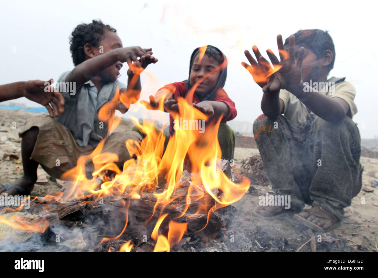 Homeless children create fire by using discarded wood or plastic to ...