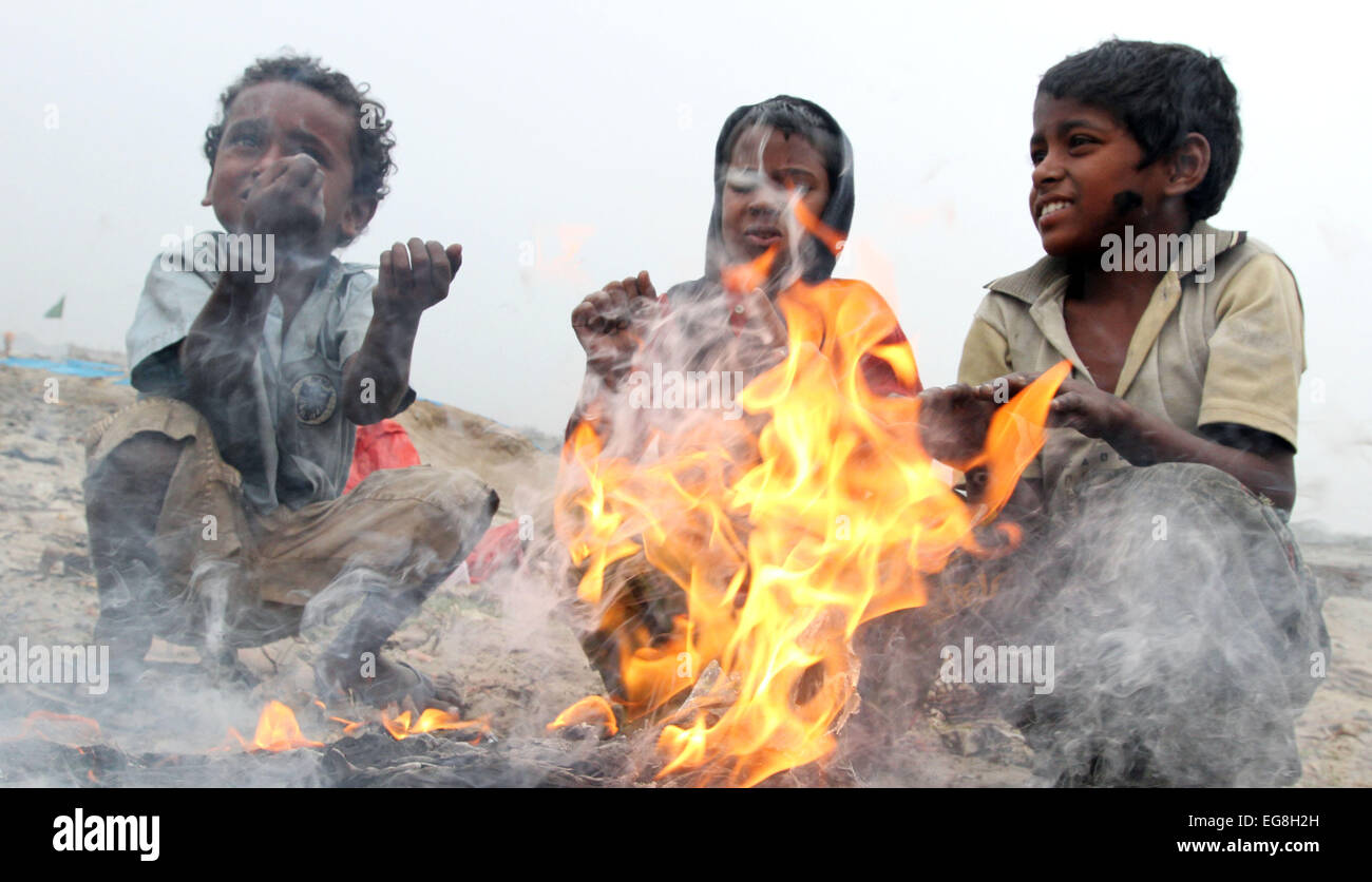 Homeless children create fire by using discarded wood or plastic to ...
