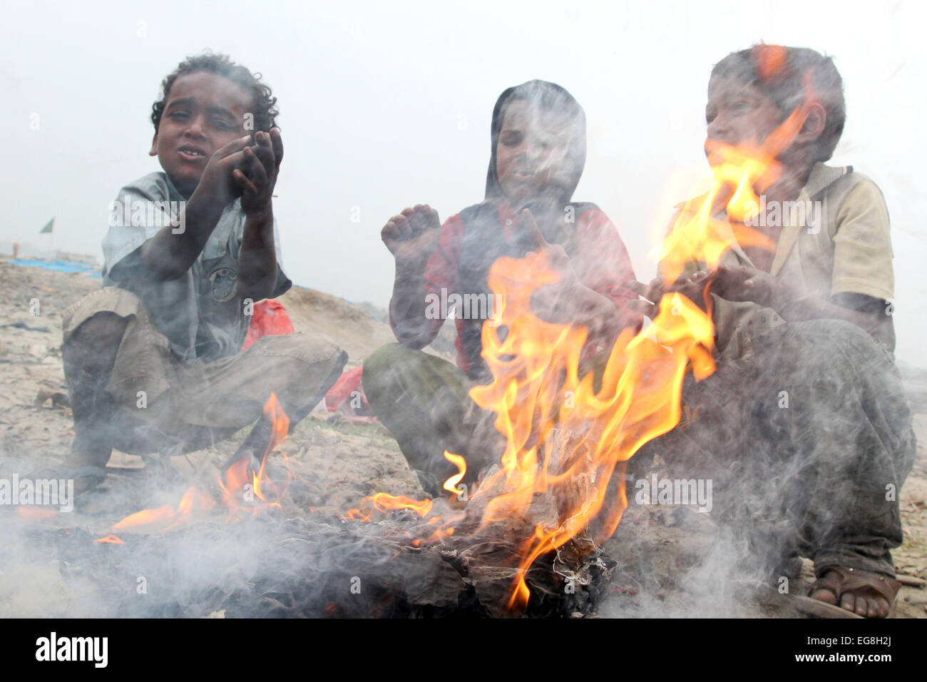 Homeless children create fire by using discarded wood or plastic to ...