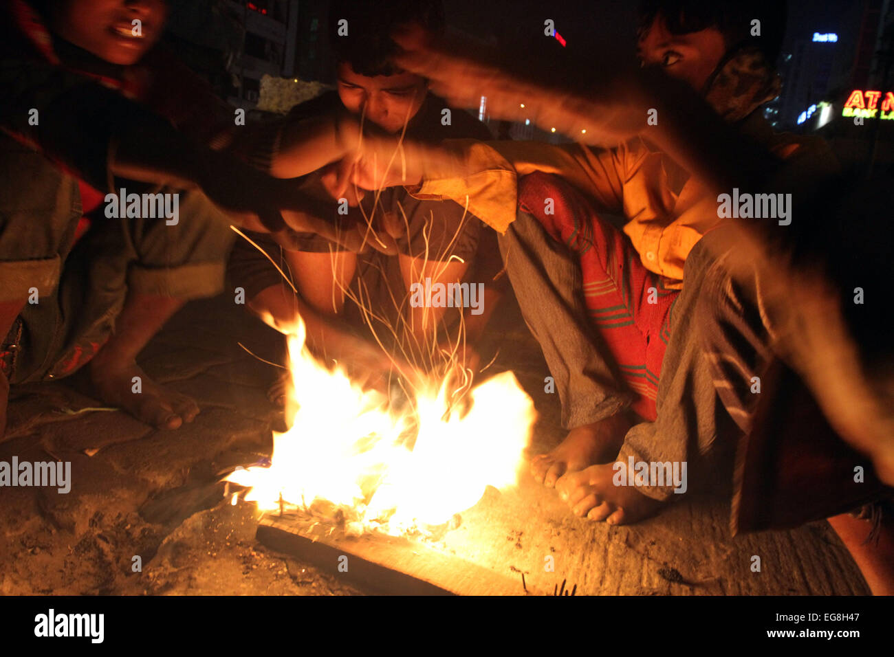 Homeless children create fire by using discarded wood or plastic to ...