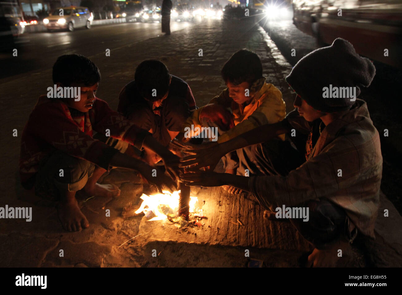 Homeless children create fire by using discarded wood or plastic to ...