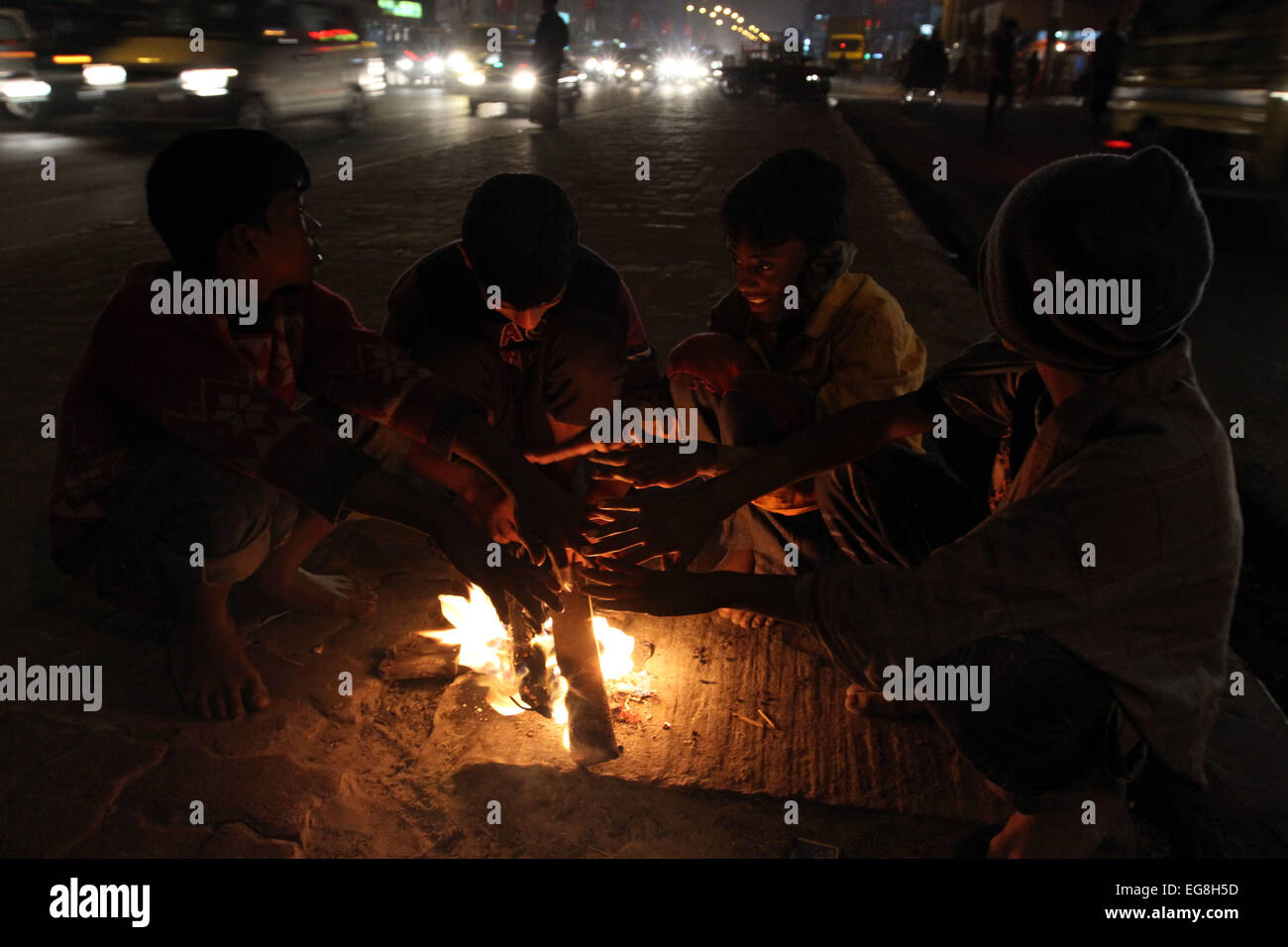 Homeless children create fire by using discarded wood or plastic to ...