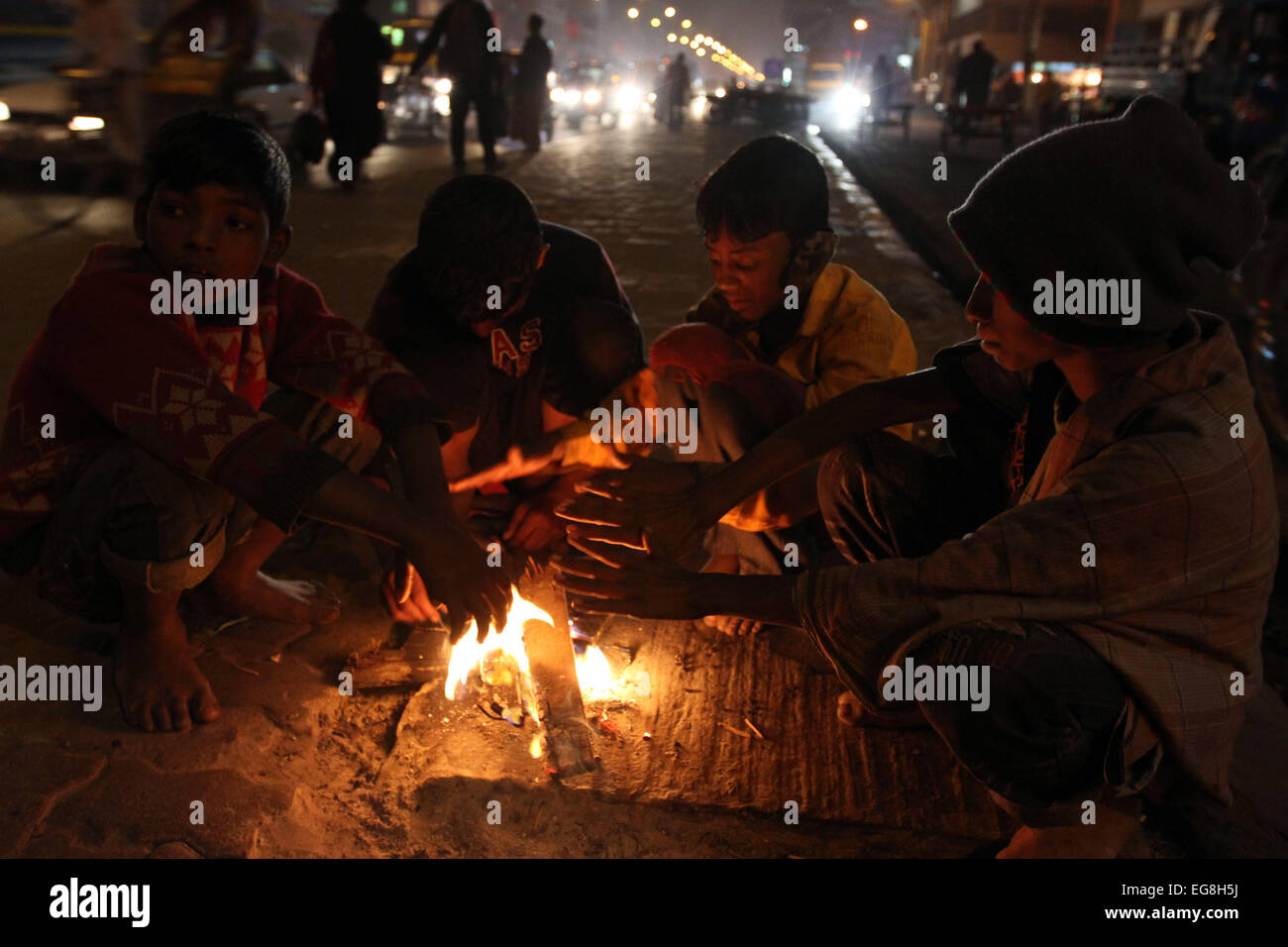 Homeless children create fire by using discarded wood or plastic to ...