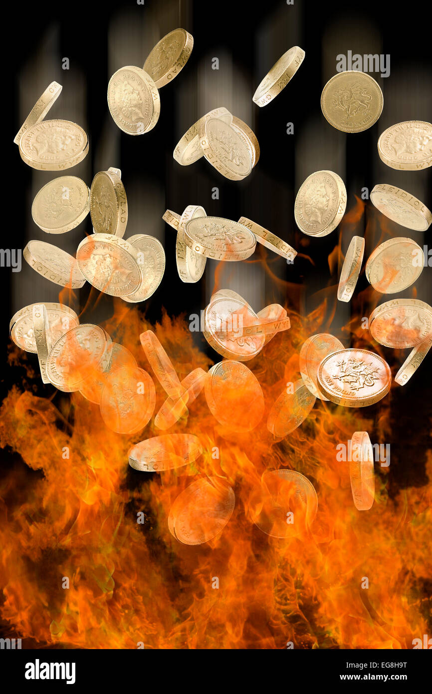 concept image of british uk money coins falling into flames Stock Photo ...