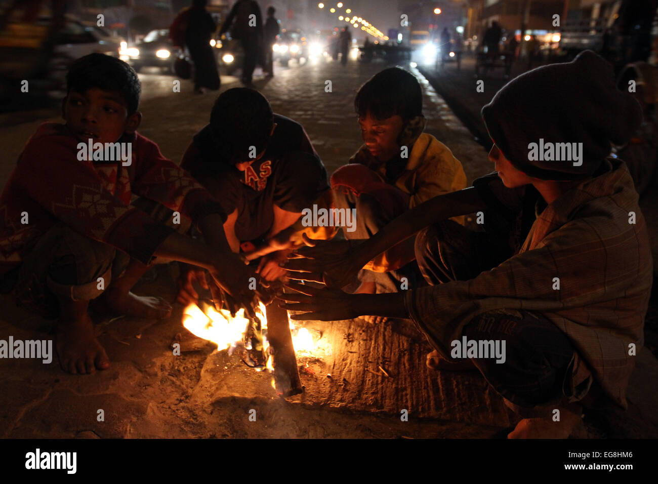 Homeless children create fire by using discarded wood or plastic to ...