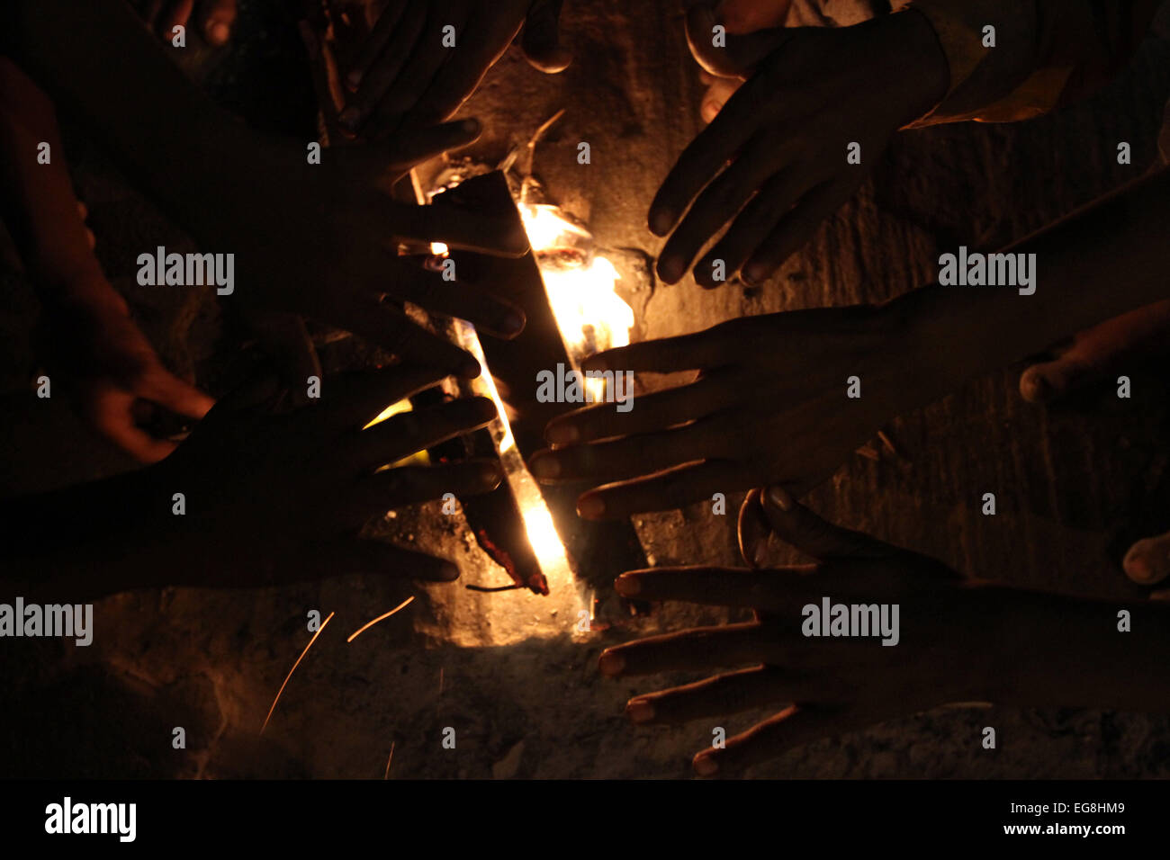 Homeless children create fire by using discarded wood or plastic to ...