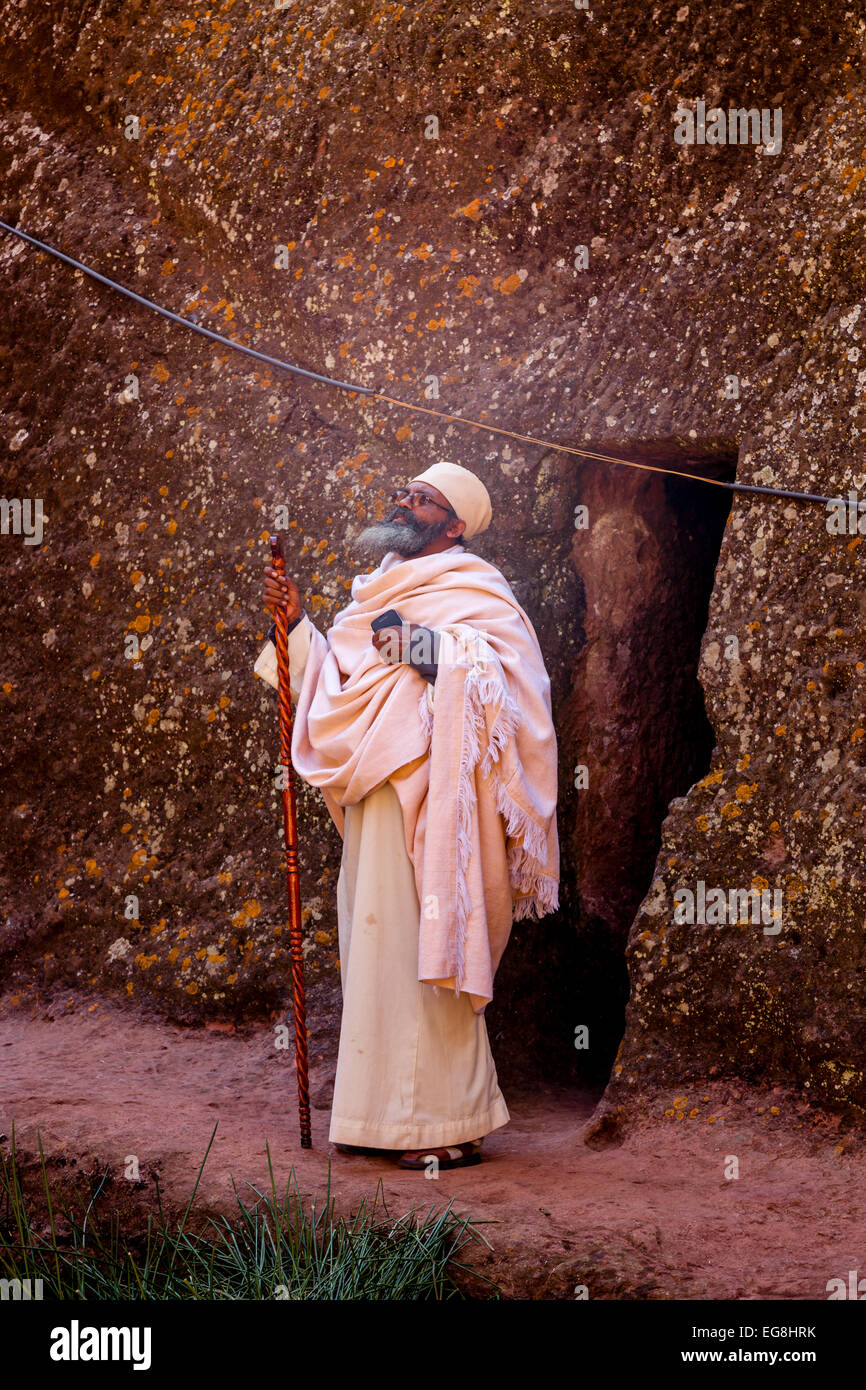 A Priest Praying At Biete Giyorgis (Saint Georges) Church, Lalibela ...