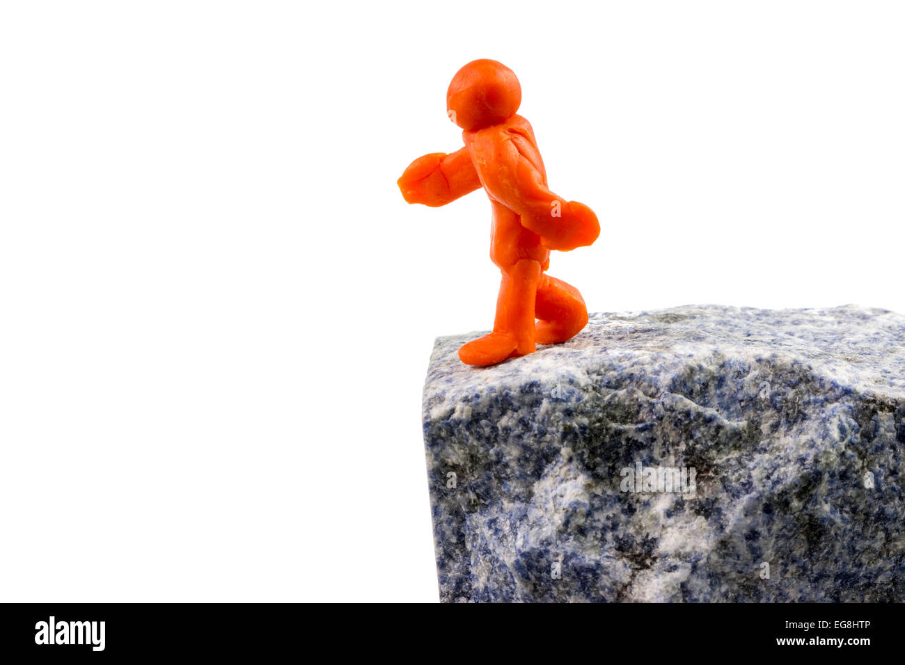 Self-made human plasticine figure walking to the edge of the abyss ...
