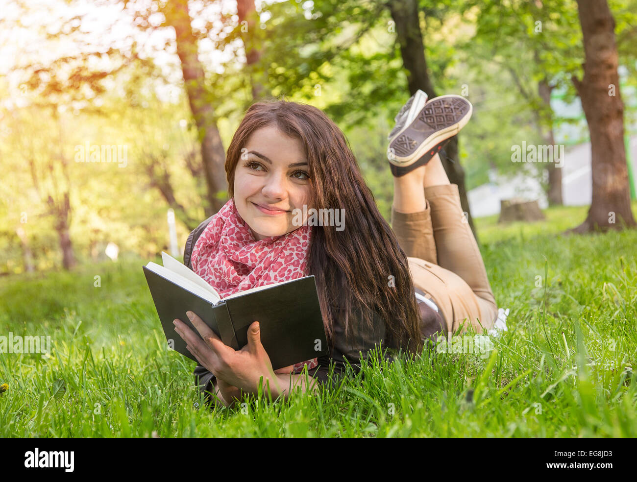 beautiful sunny portrait of a girl book Stock Photo - Alamy