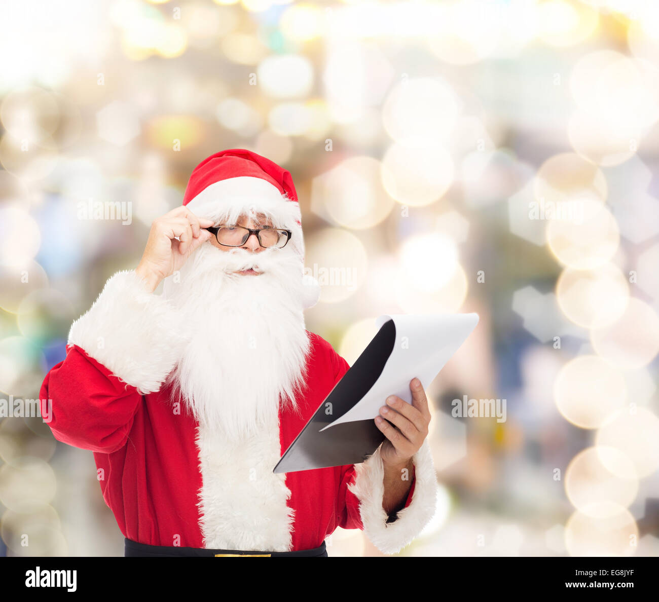 man in costume of santa claus with notepad Stock Photo - Alamy