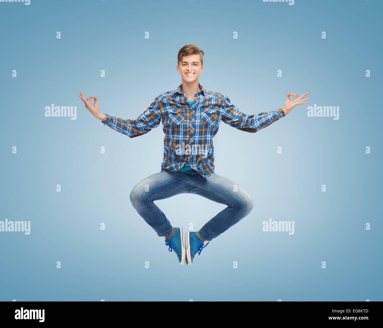 smiling young man jumping in air Stock Photo - Alamy