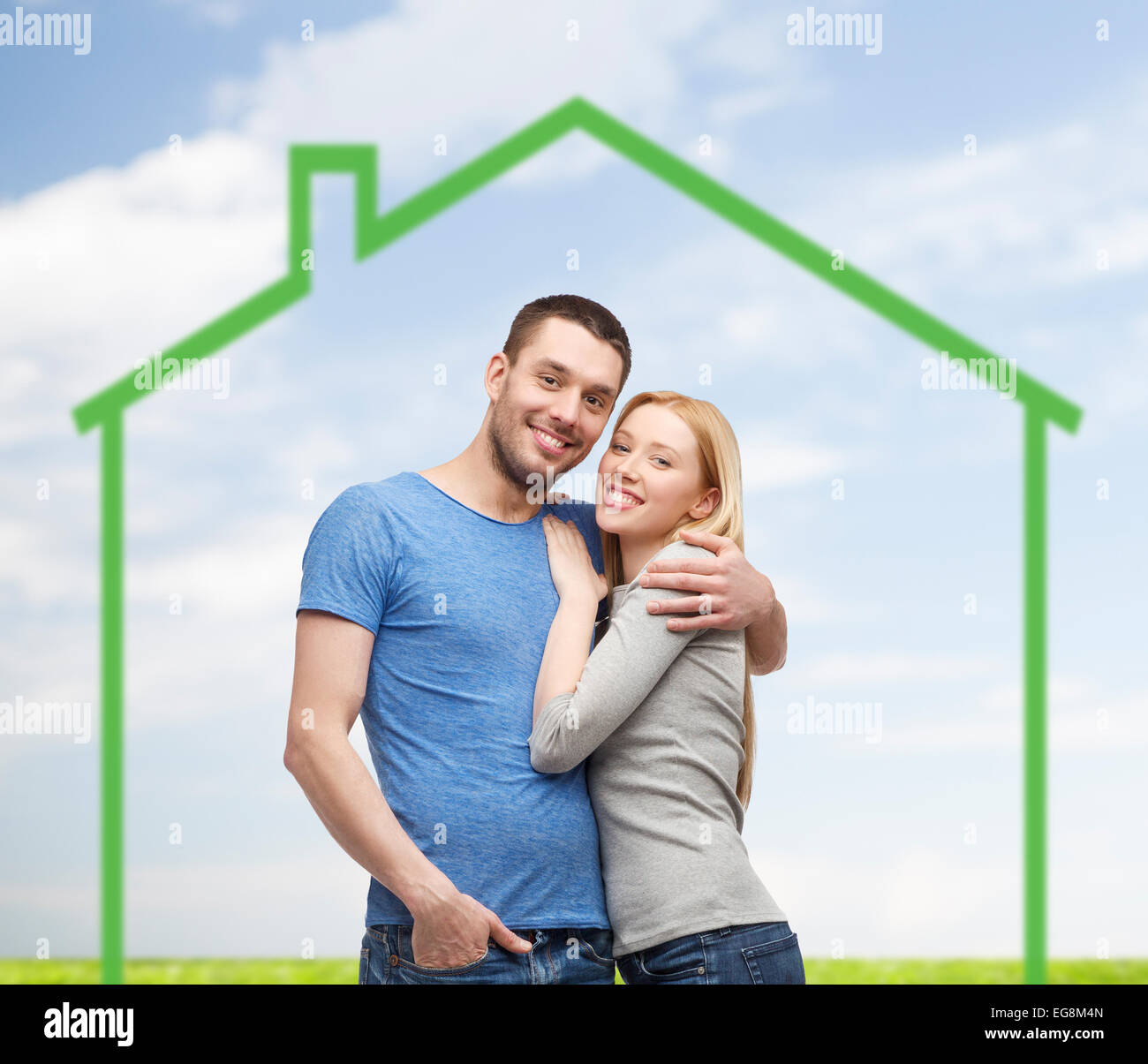 smiling couple hugging over green house Stock Photo - Alamy