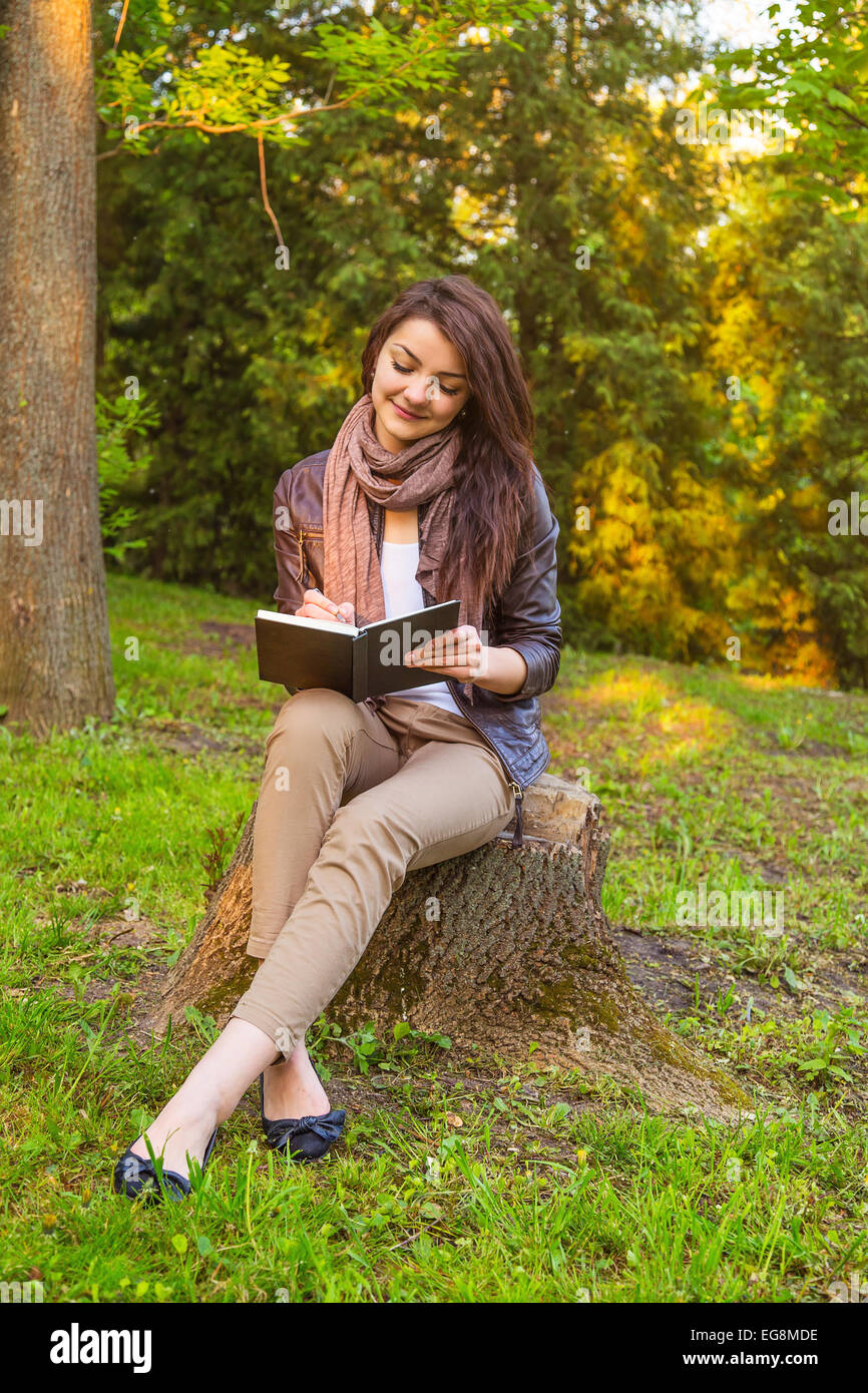 beautiful sunny portrait of a girl book Stock Photo - Alamy