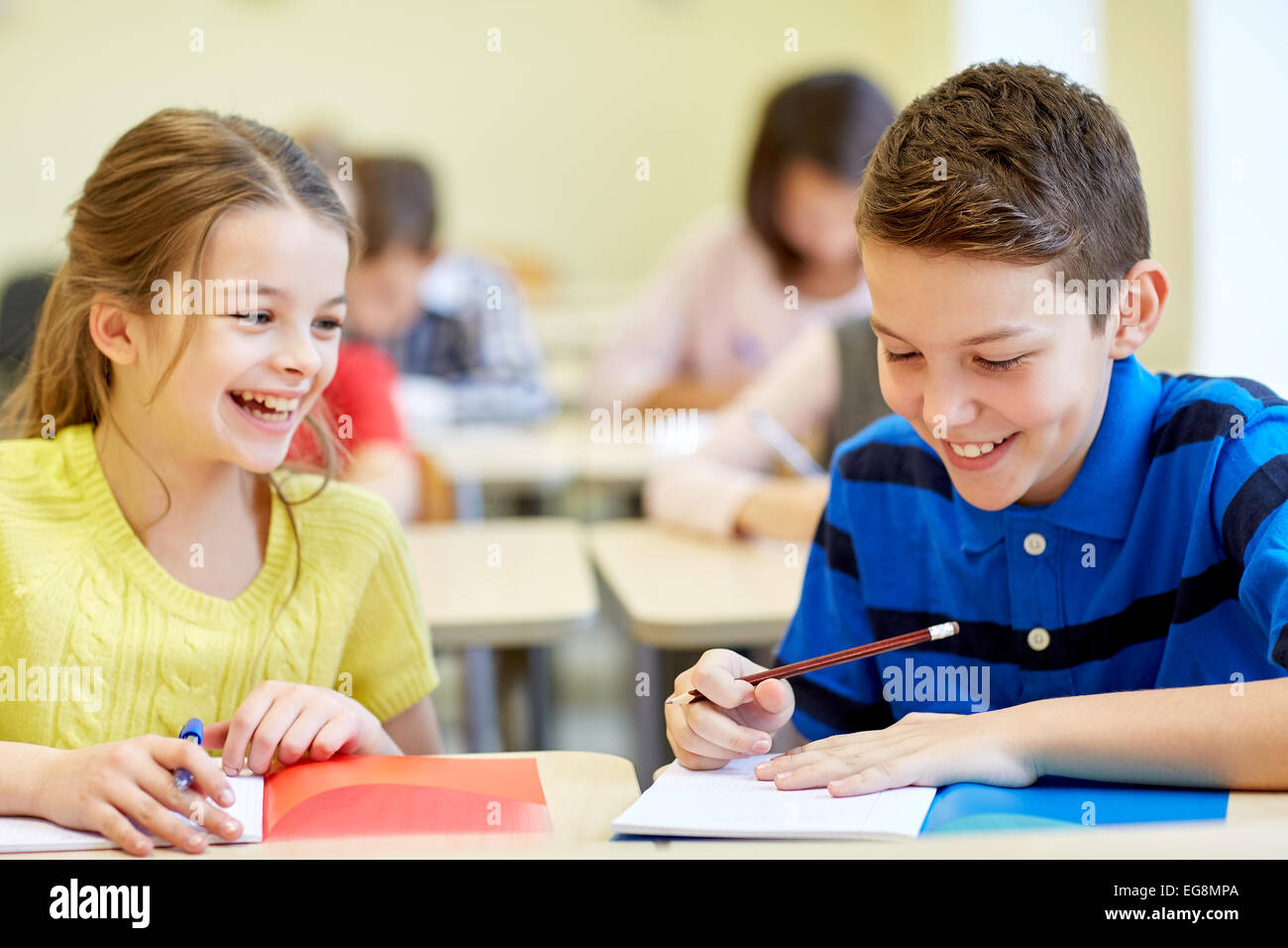 group of school kids writing test in classroom Stock Photo - Alamy