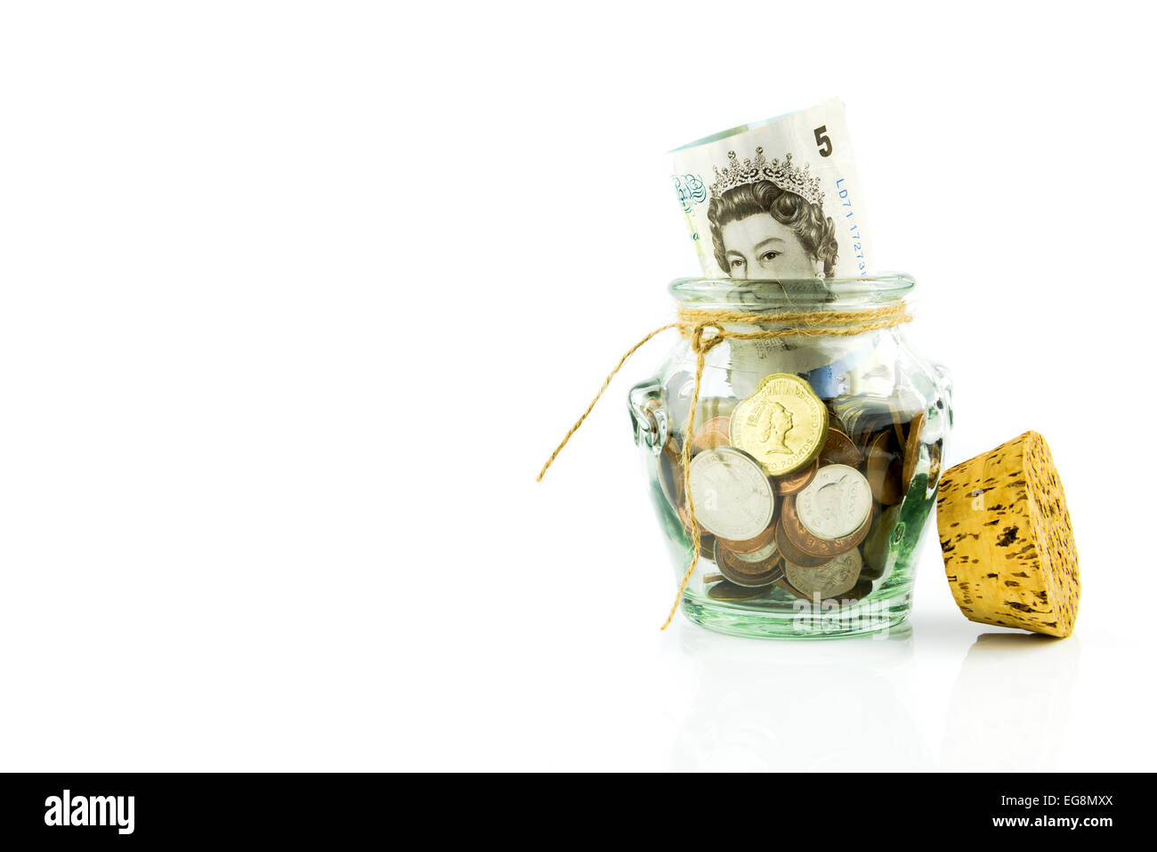 Money - coins and banknotes - in a jar on white background Stock Photo ...