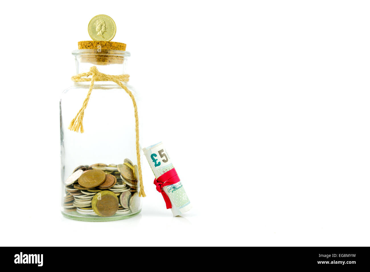 Money - coins and banknotes - in a jar on white background Stock Photo ...