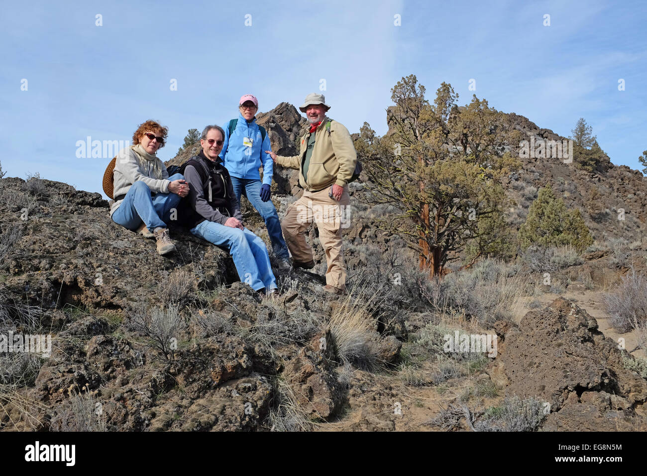 Hikers at Badlands Rock, on the Badlands Rock trail in Badlands ...
