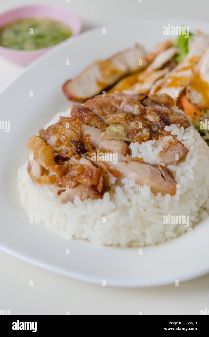 close up fried Chicken over steamed rice on plate Stock Photo - Alamy