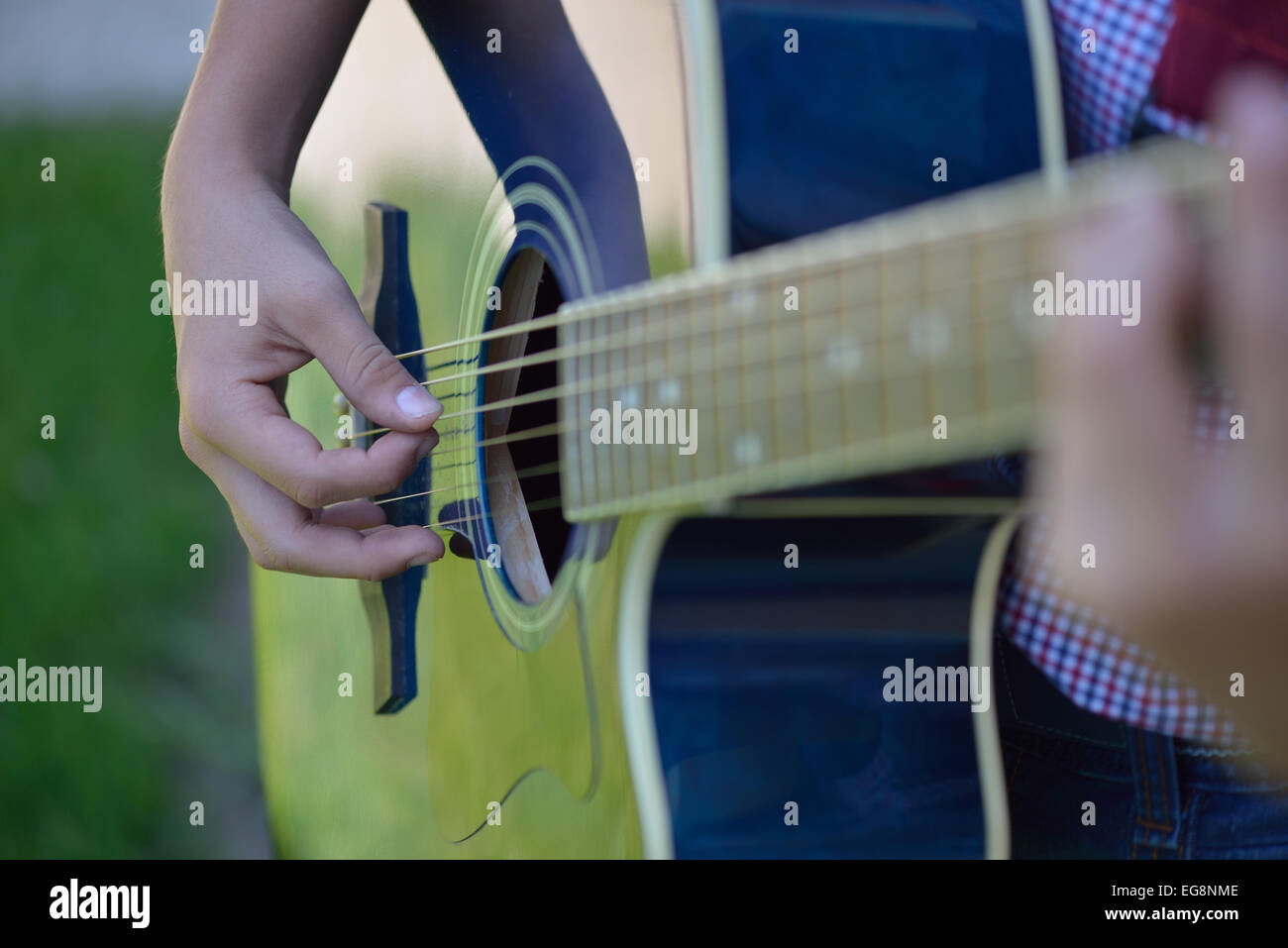 Playing acoustic guitar Stock Photo - Alamy