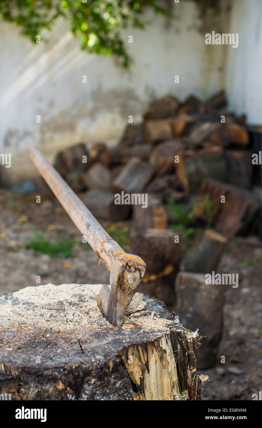 Axe on stump Stock Photo - Alamy